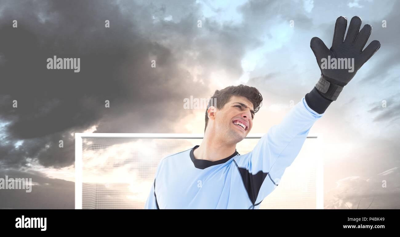 Soccer goalkeeper saving in goal Stock Photo - Alamy