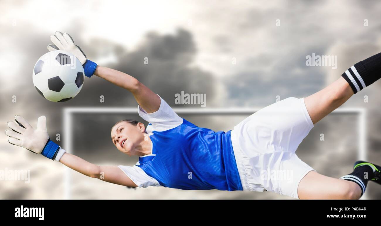 Soccer goalkeeper saving ball in goal Stock Photo - Alamy