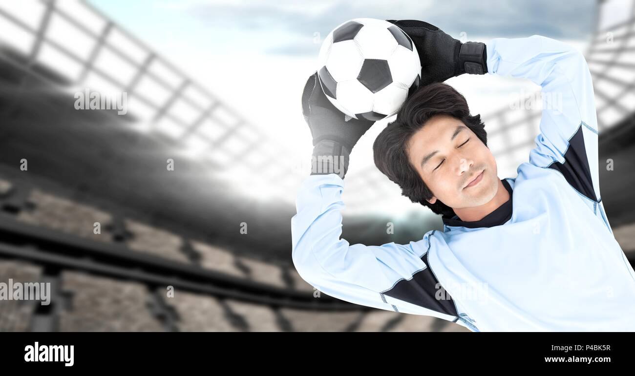 Soccer goalkeeper saving ball in goal Stock Photo - Alamy