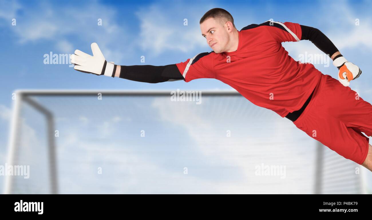 Soccer goalkeeper saving in goal Stock Photo - Alamy