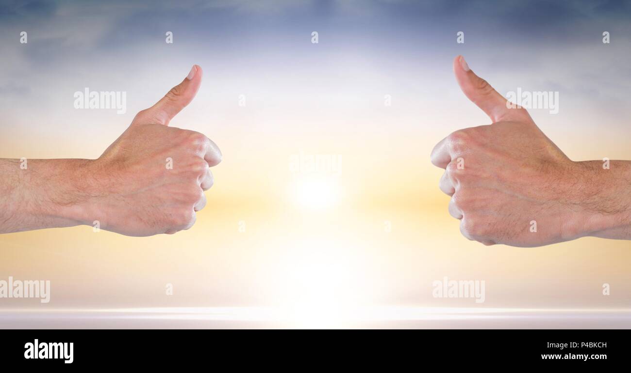 Composite image of thumbs up on sunrise background Stock Photo - Alamy