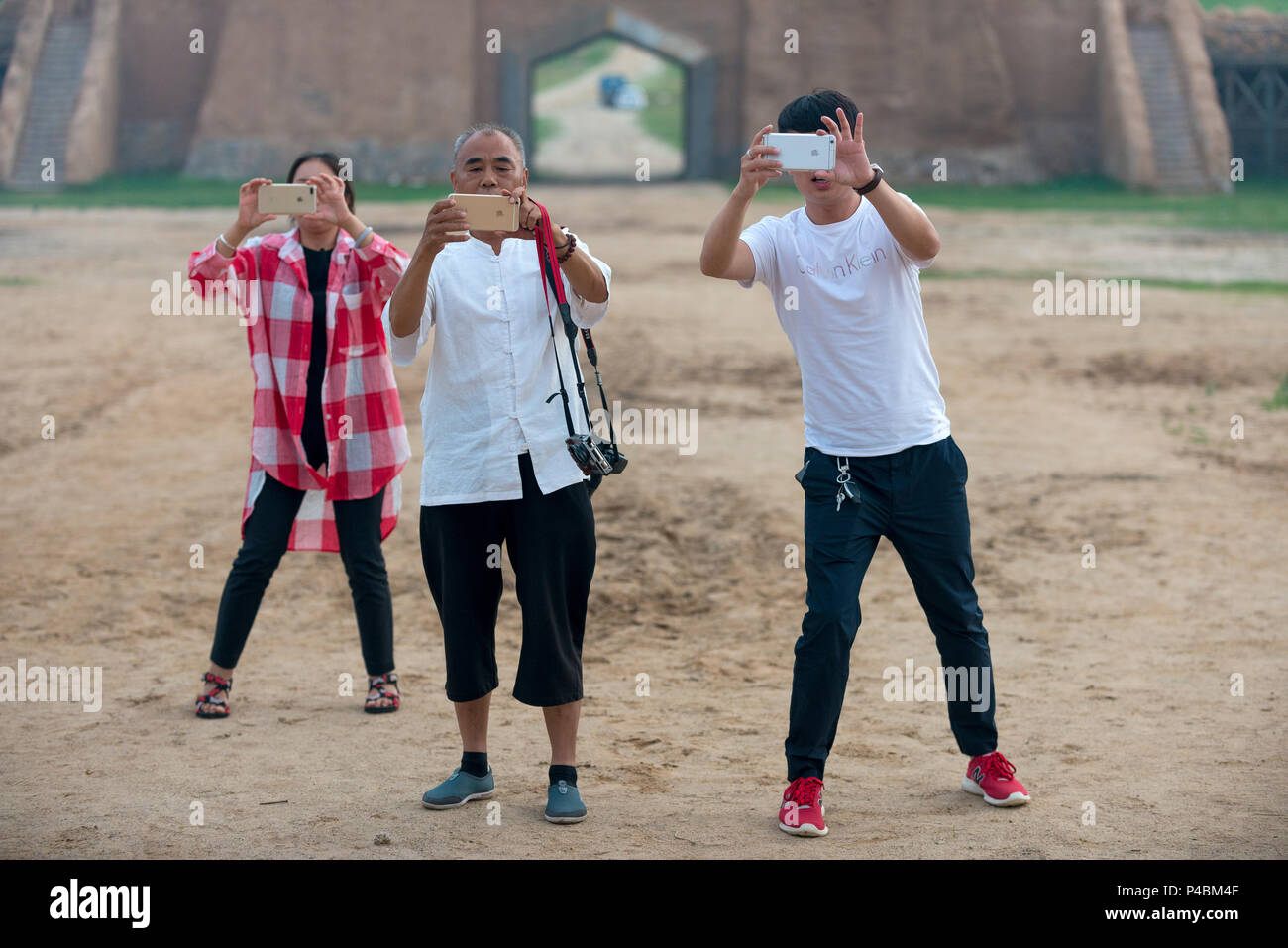 Tourists snap phone photographs at Zhenglanqi Wuyi Farm, Inner Mongolia ...