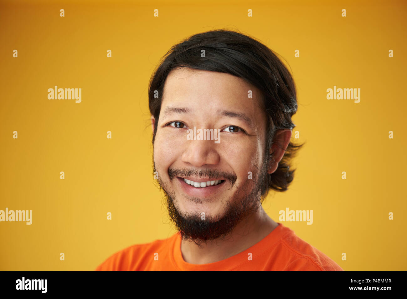 Smiling yellow man hi-res stock photography and images - Alamy