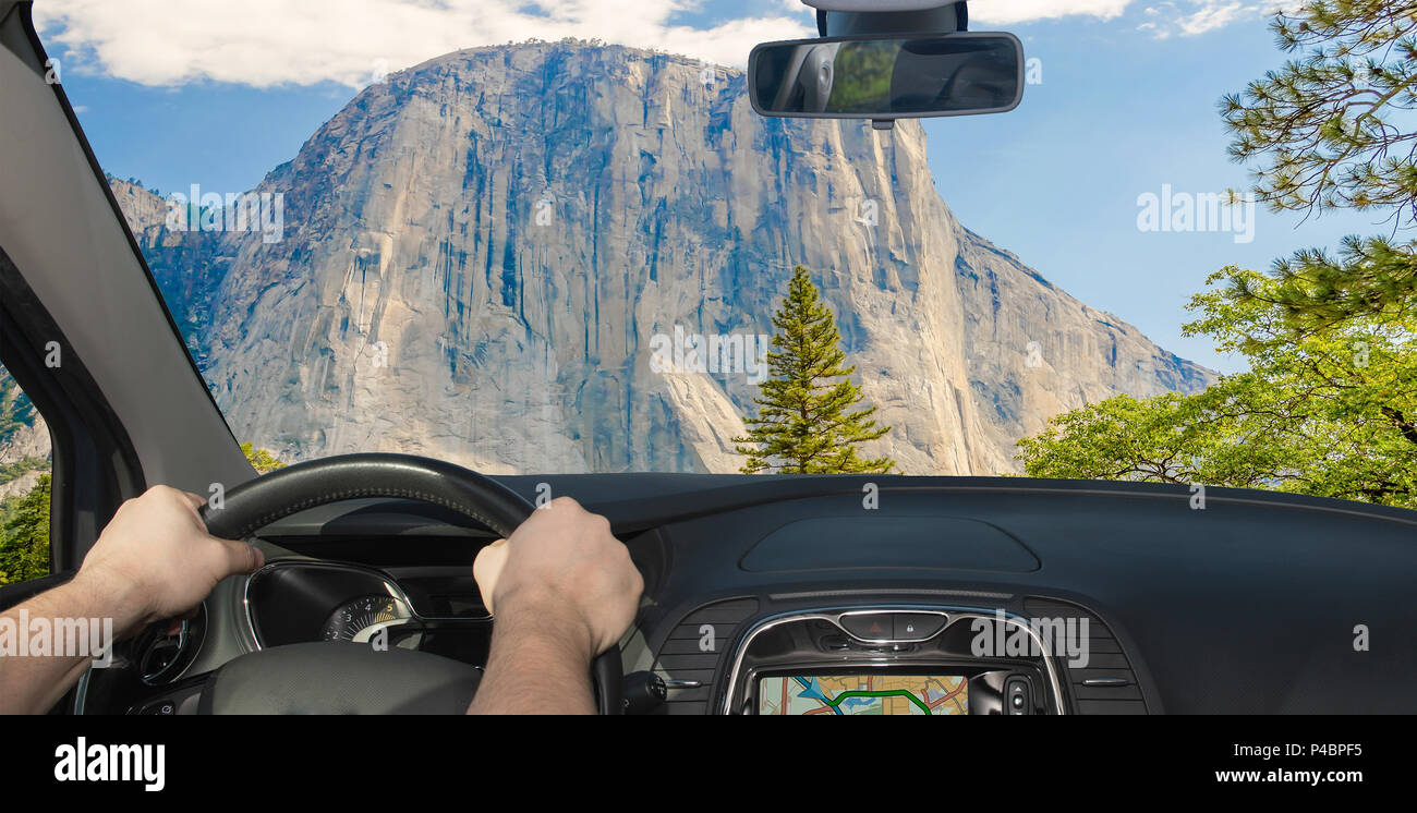 Driving a car towards El Capitan, iconic mountain in Yosemite National ...