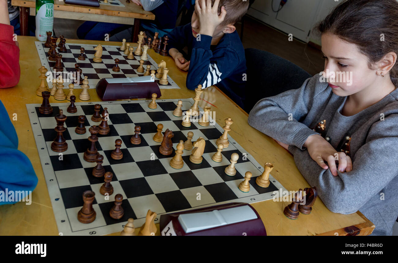 Russia, Vladivostok, 02/24/2018. Kids play chess during chess ...