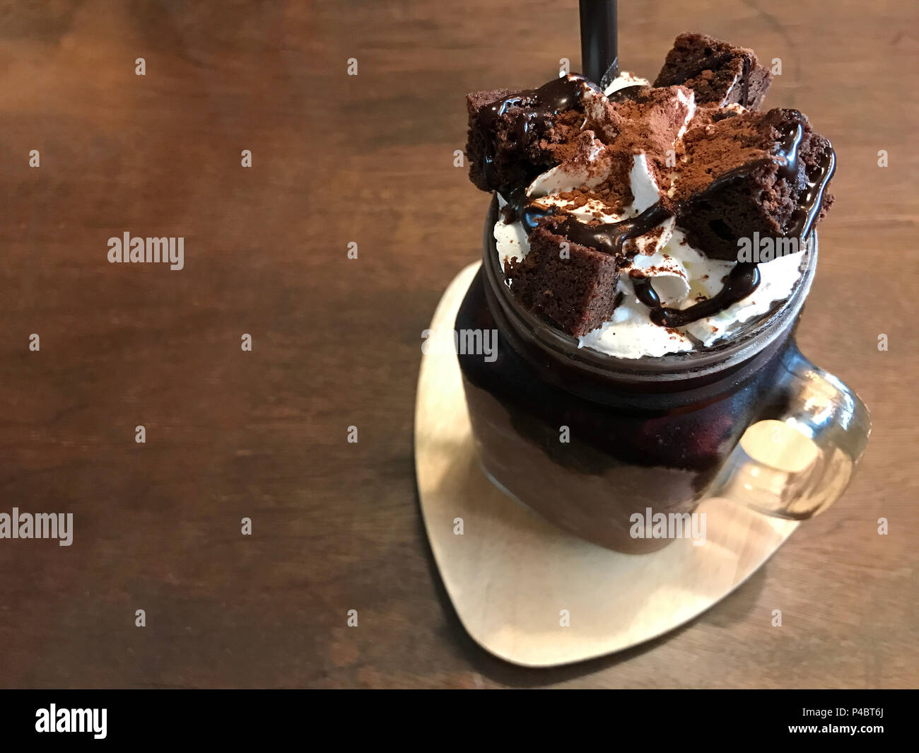 Chocolate milkshake with brownie topping in the cafe Stock Photo - Alamy