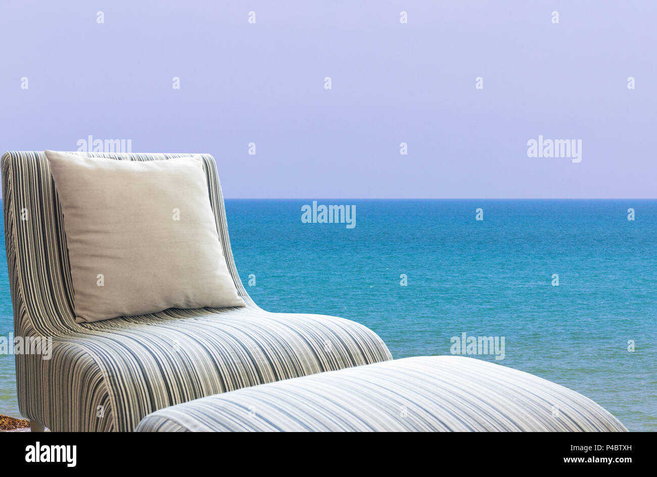 Modern sofa on beautiful sky and sea background Stock Photo - Alamy