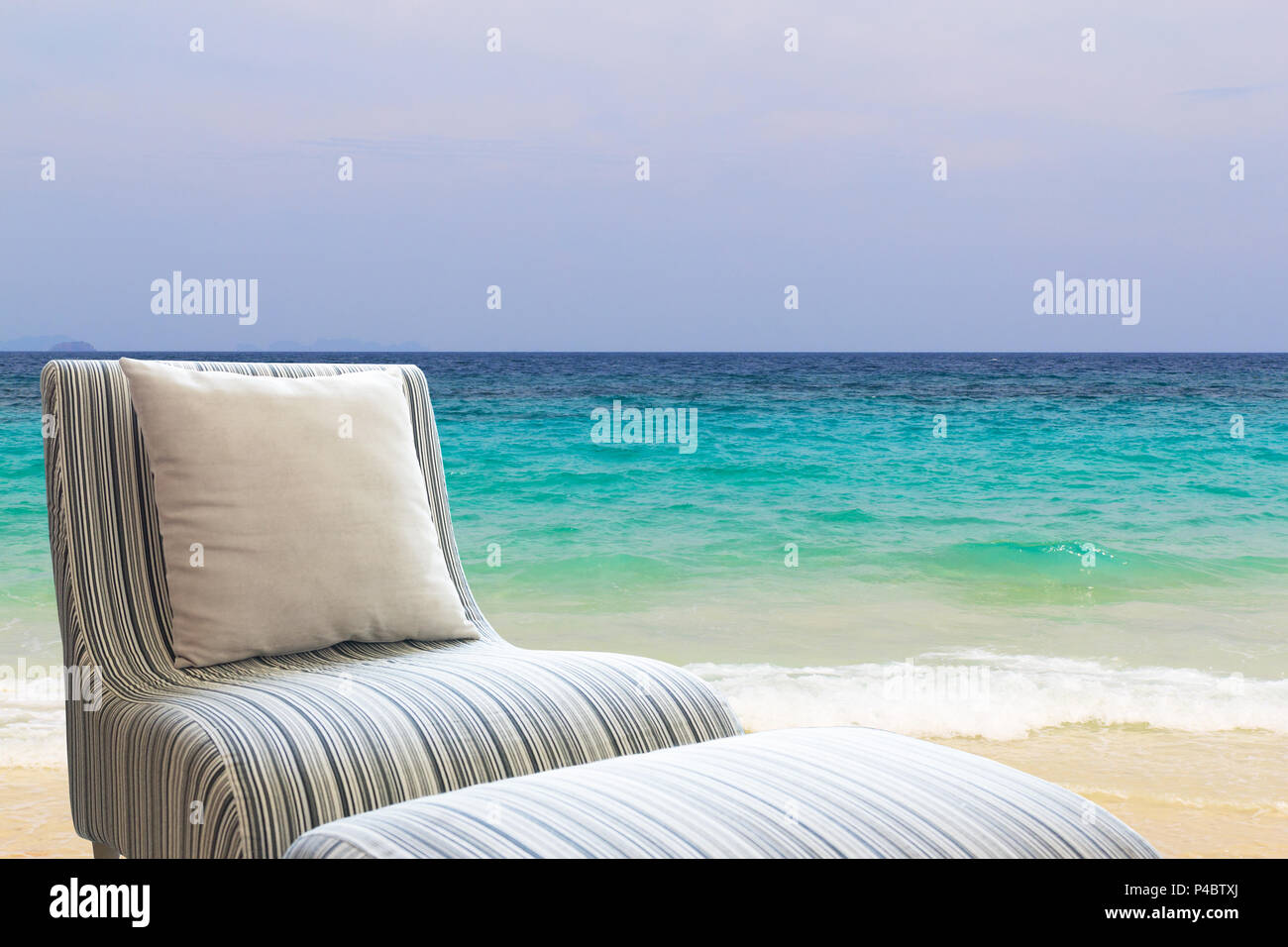 Modern sofa on the beach, concept background Stock Photo - Alamy