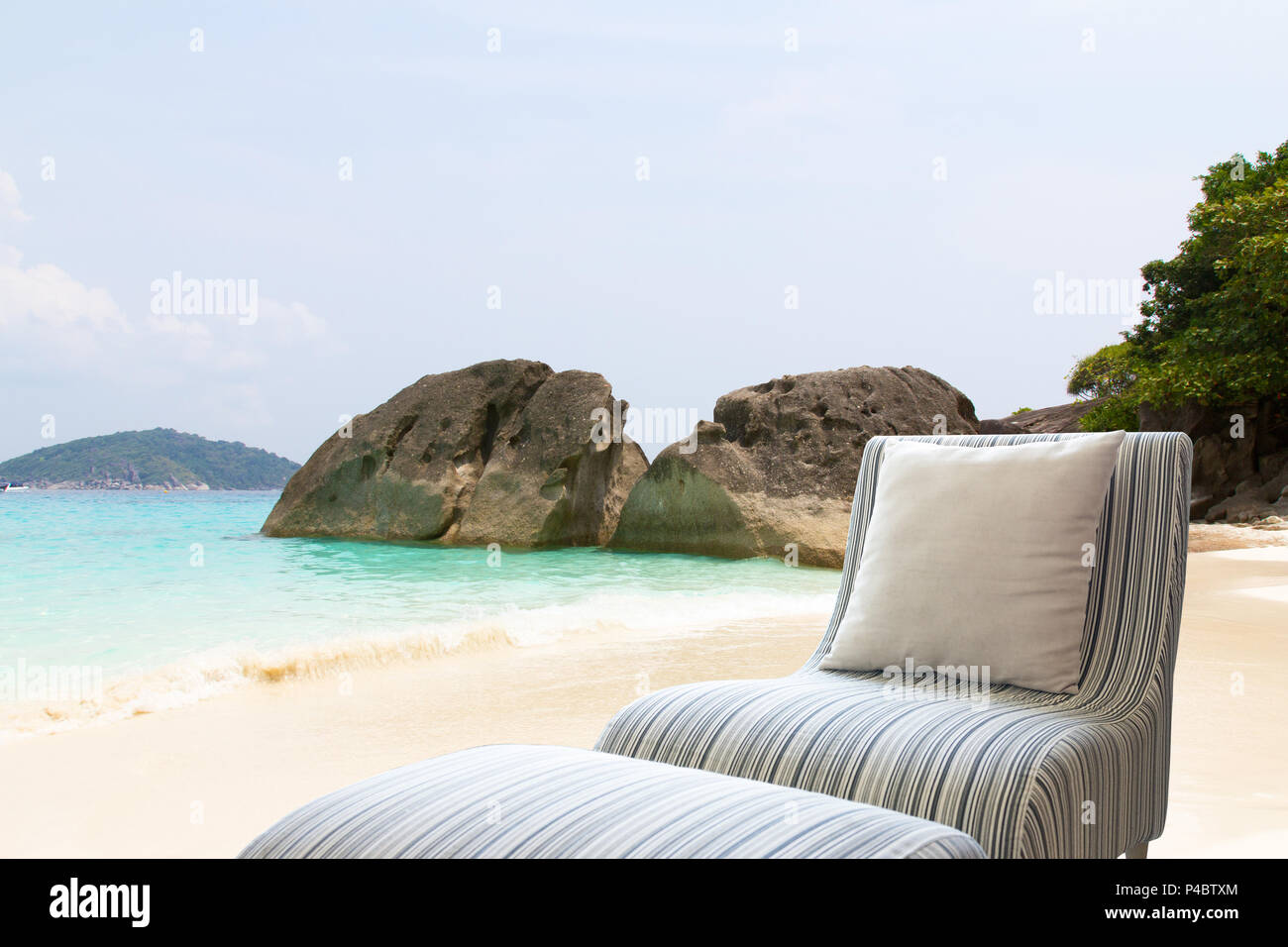 Modern sofa on the beach, concept background Stock Photo - Alamy