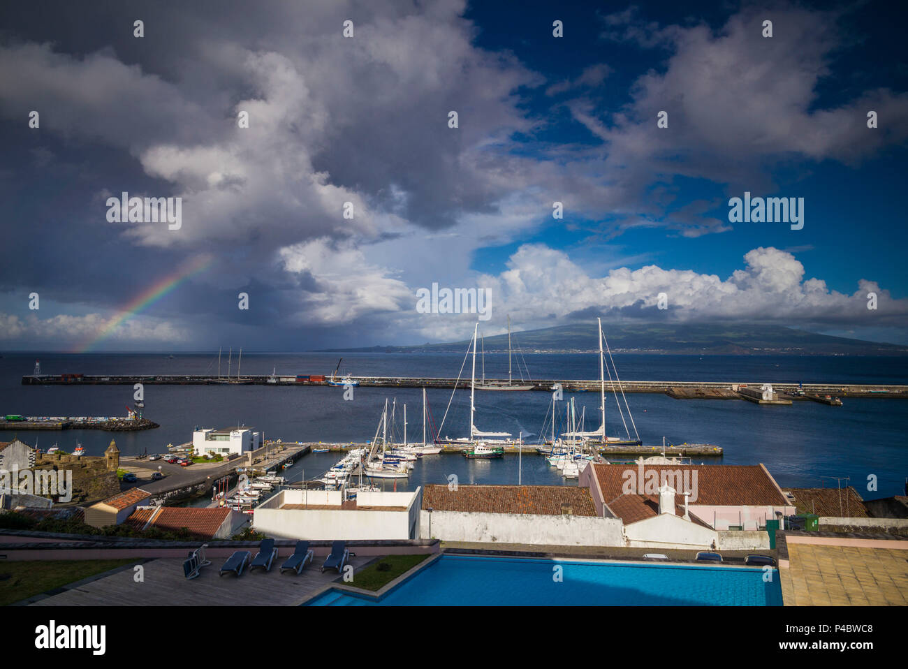 Elevated view of waterfront and pico volcano and rainbow hi-res stock ...