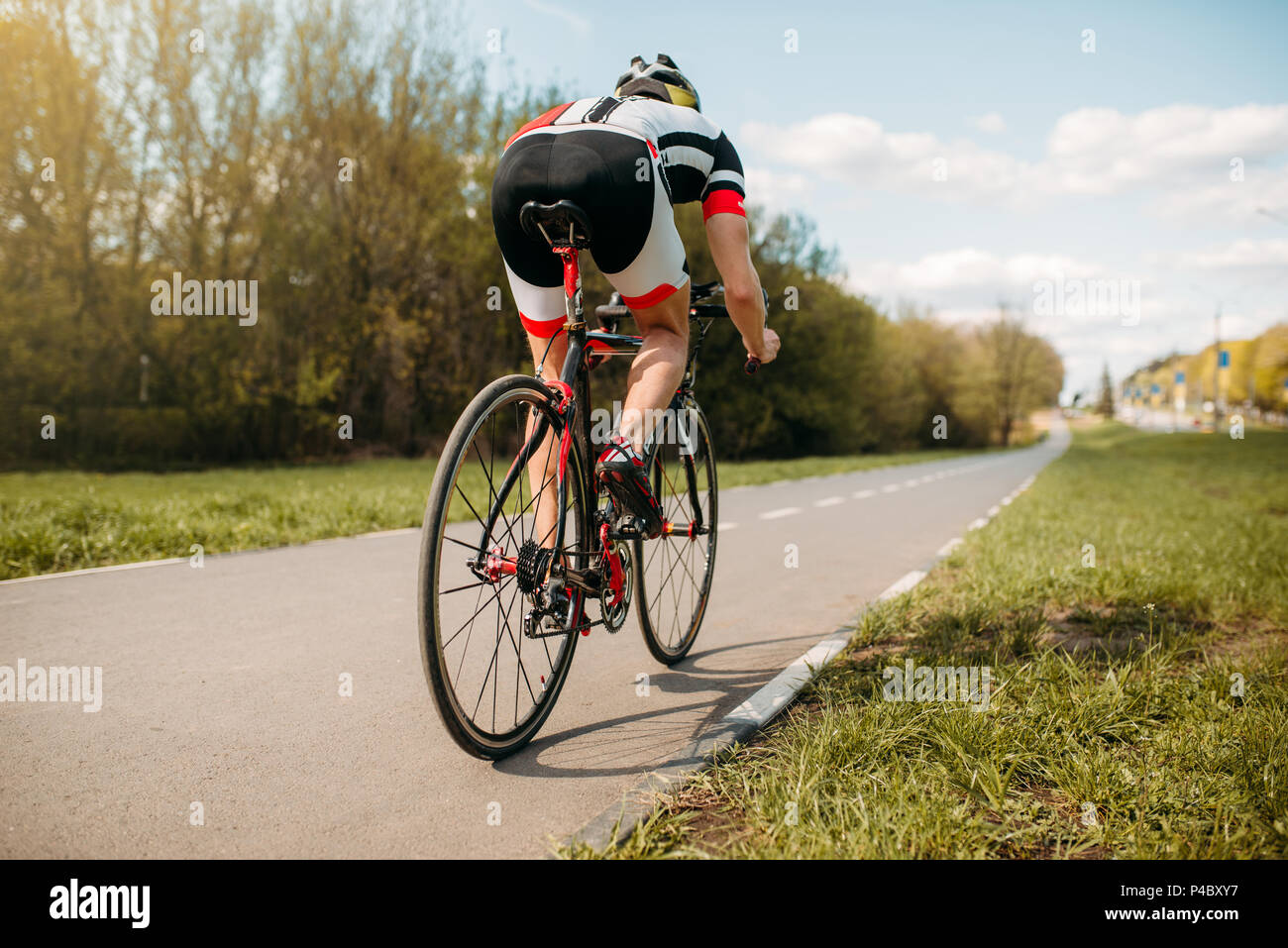 Man on bicycle rides path hi-res stock photography and images - Alamy