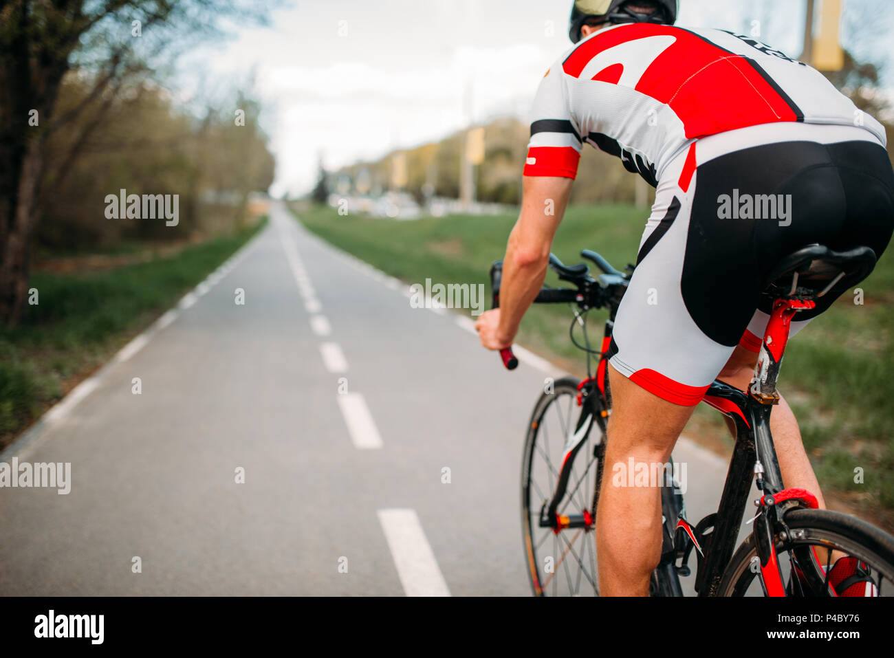 Male cyclist in helmet rides hi-res stock photography and images - Alamy
