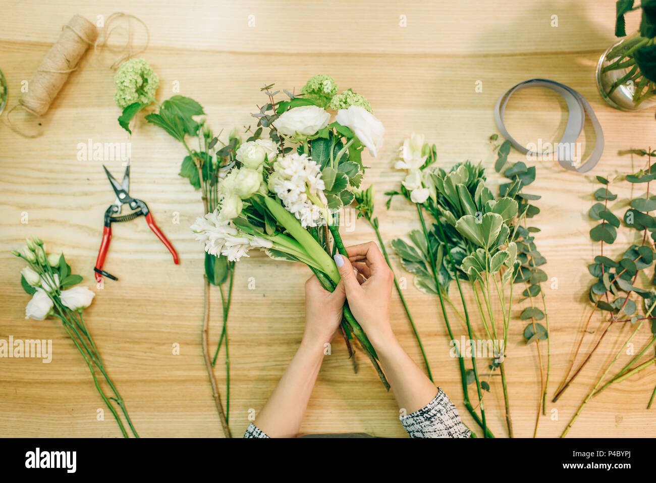 Woman florist cuts rose hi-res stock photography and images - Alamy