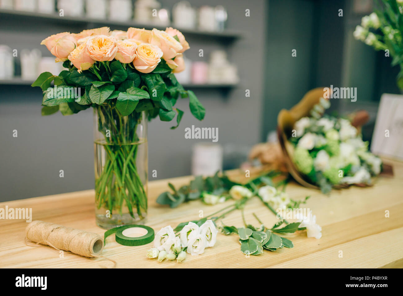 Fresh rose bouquet composition in flower boutique Stock Photo - Alamy