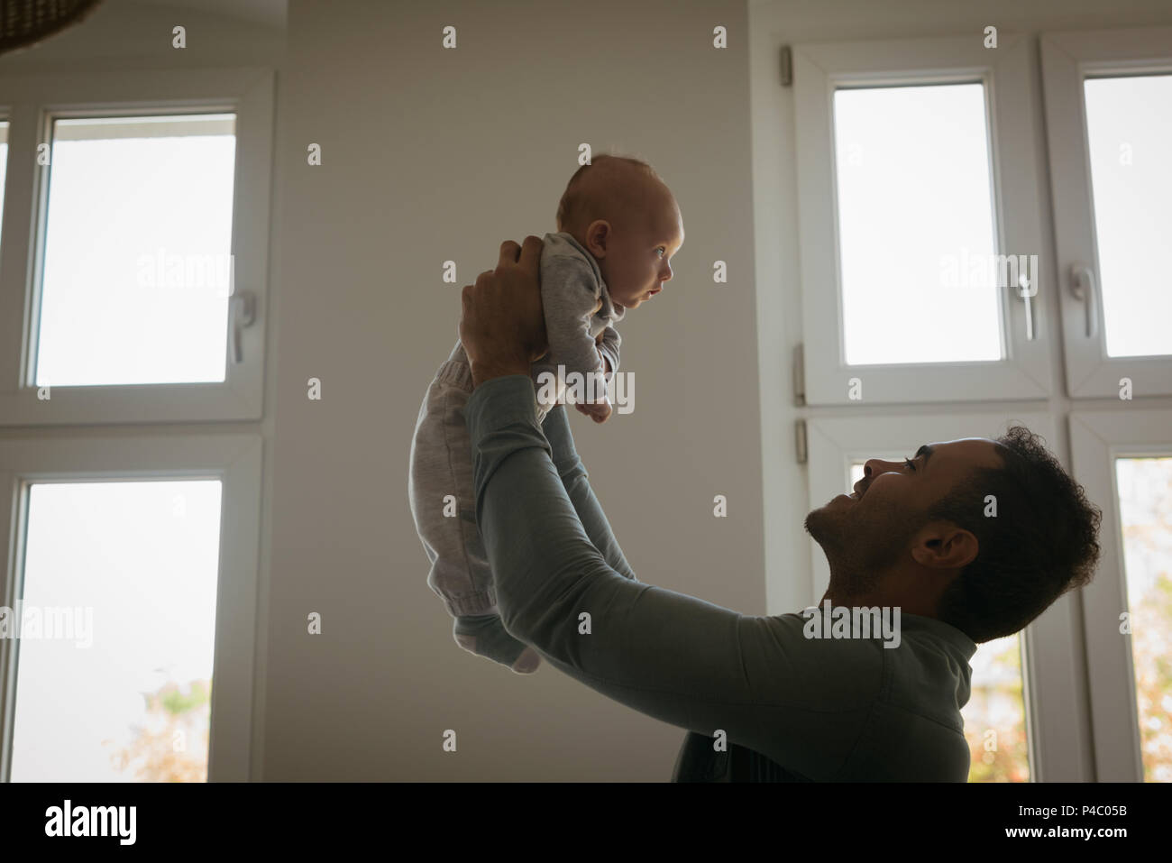 Father playing with his baby Stock Photo - Alamy