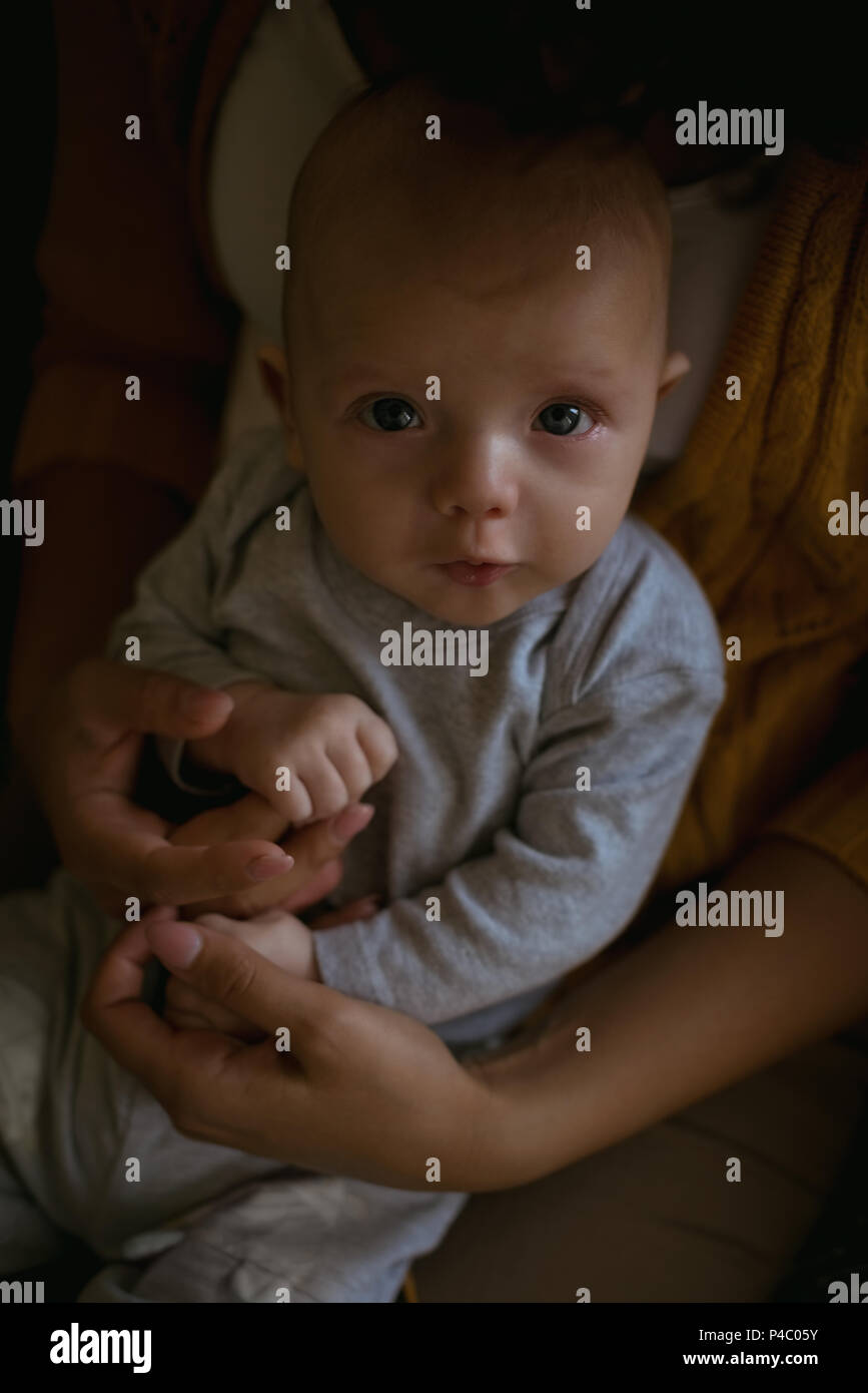 Mid section of woman sitting with her baby Stock Photo - Alamy