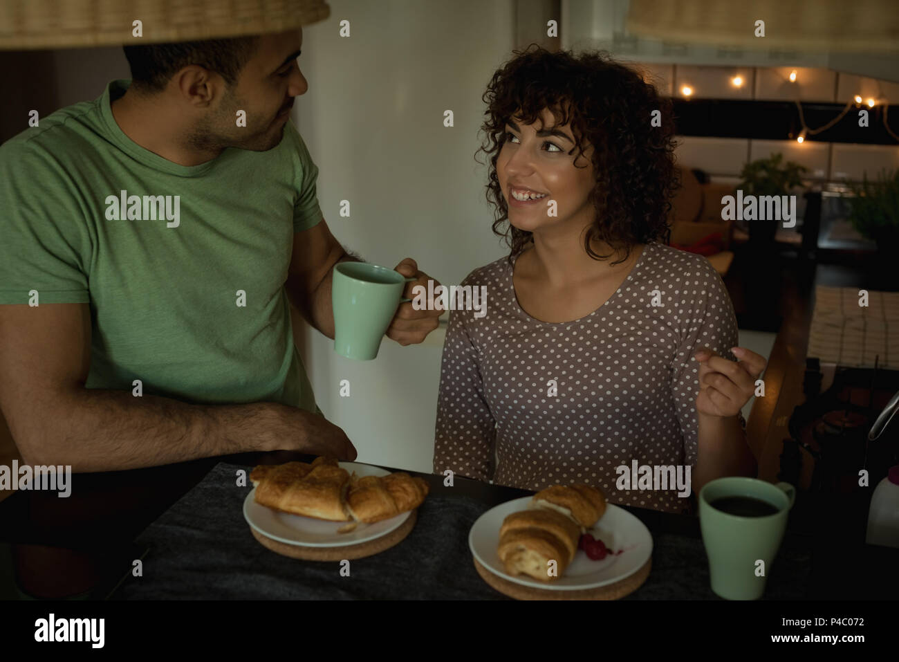 Couple having breakfast together Stock Photo - Alamy