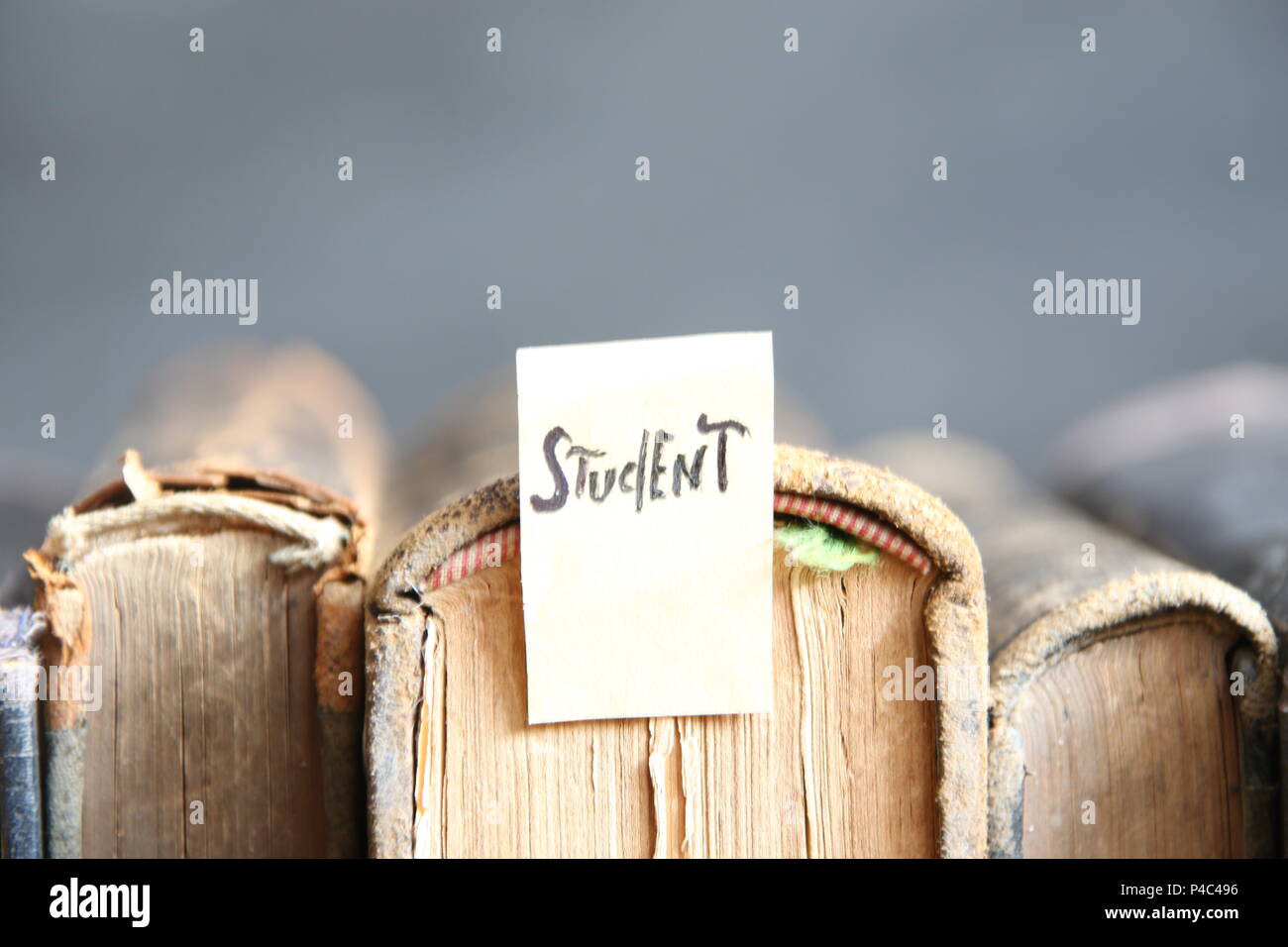student idea, tag and old vintage books books on a shelf in the library ...