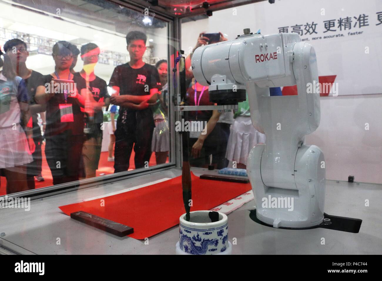 A robot writes calligraphy in Zoucheng, east China's Shandong Province ...