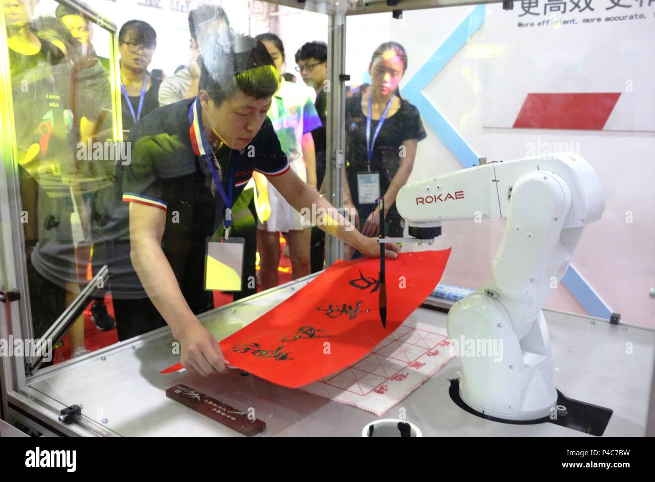 A robot writes calligraphy in Zoucheng, east China's Shandong Province ...