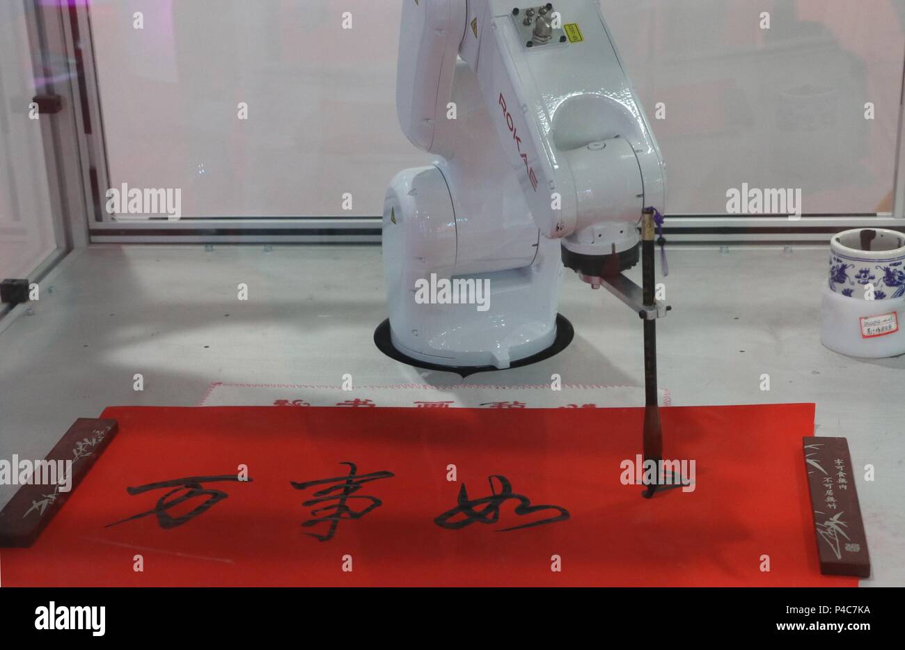 A robot writes calligraphy in Zoucheng, east China's Shandong Province ...
