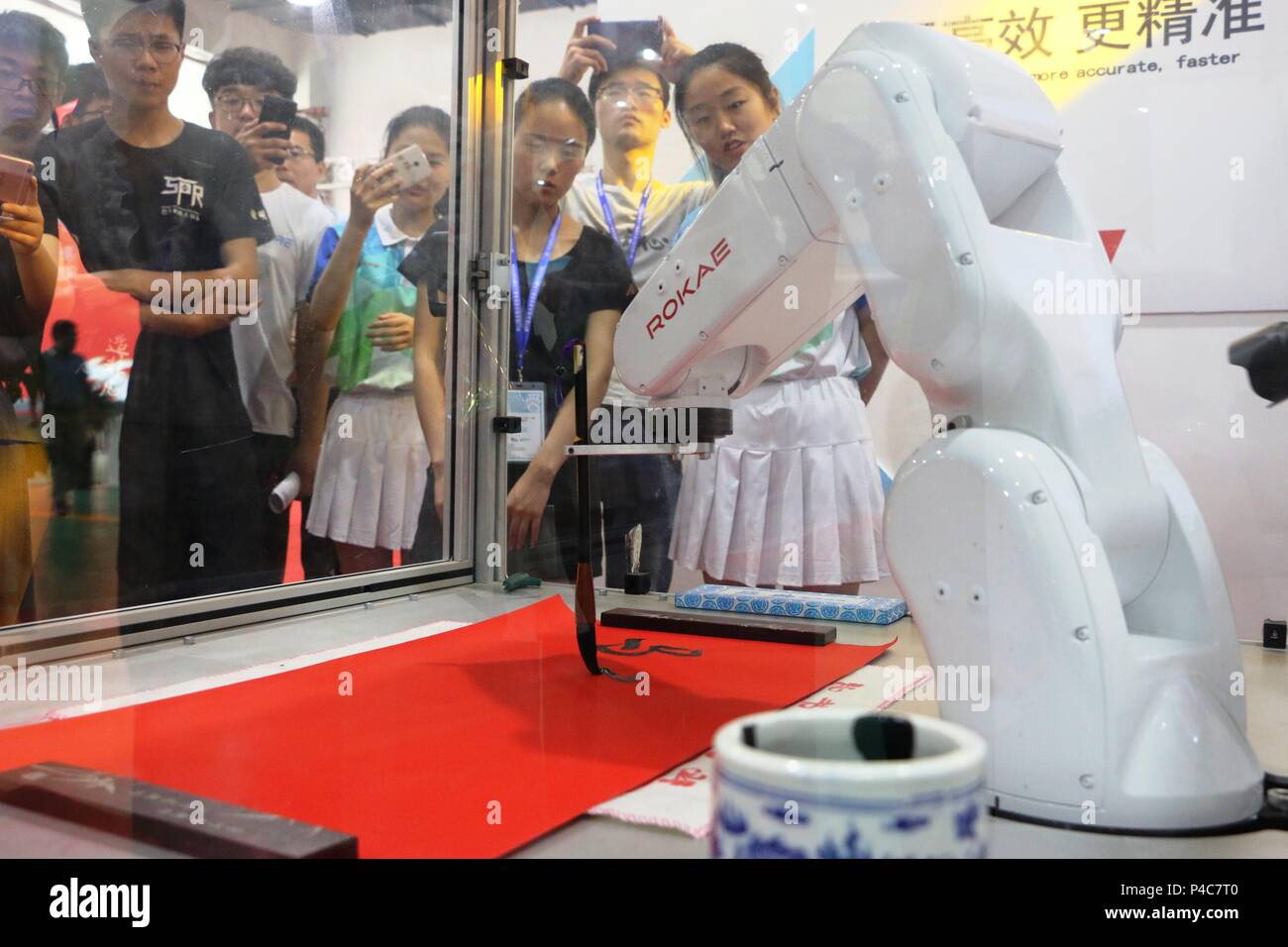 A robot writes calligraphy in Zoucheng, east China's Shandong Province ...