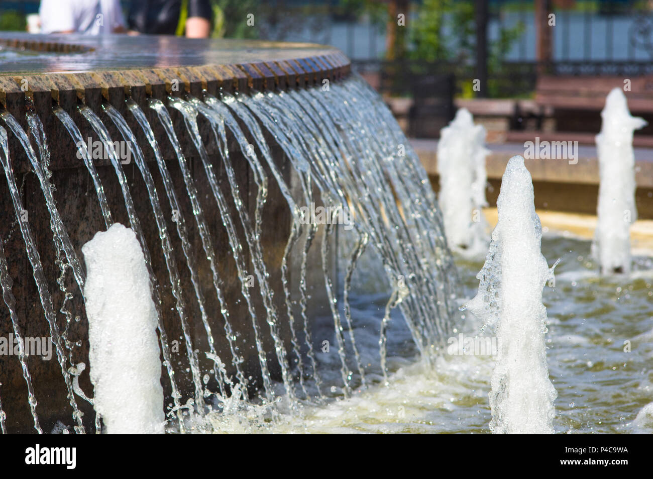 Fountain in city park on hot summer day, beautiful bright streams of ...