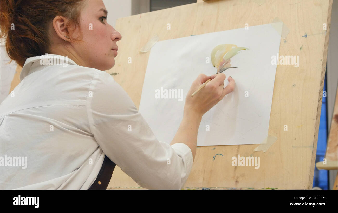 Painting process of woman artist in art workplace Stock Photo - Alamy