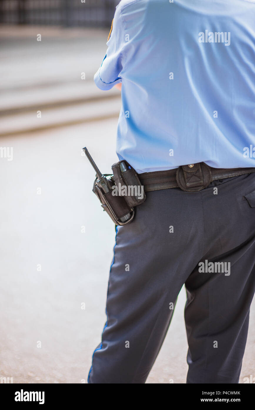 Police officer in uniform on duty in the city Stock Photo - Alamy