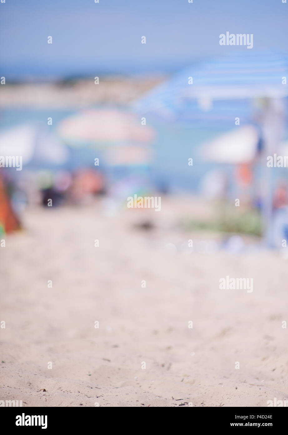 Blurred Background on a sunny day on the beach with clear blue sky and ...