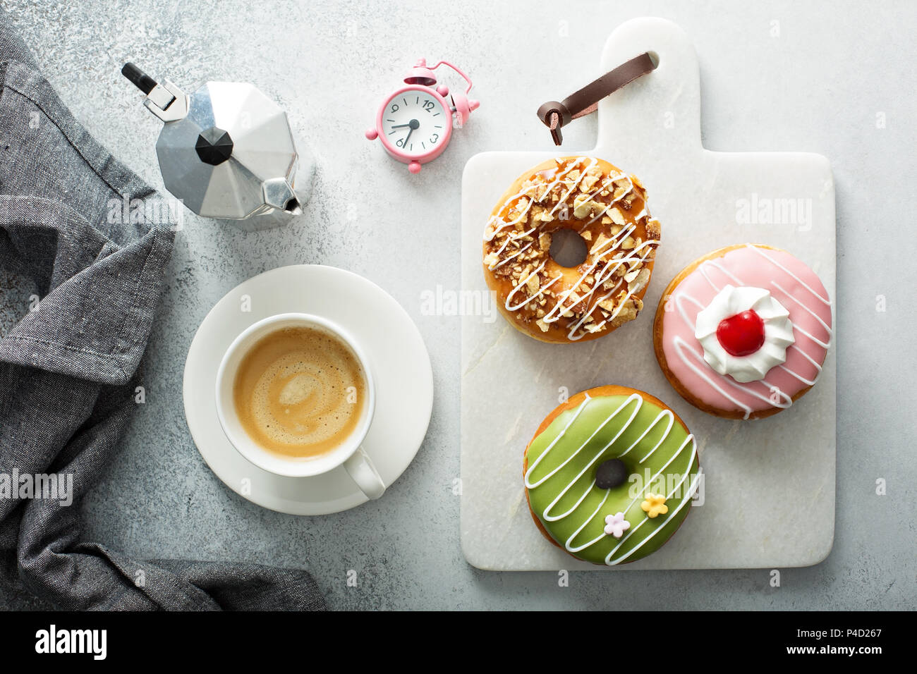 Sweet donuts on a serving board overhead view Stock Photo - Alamy