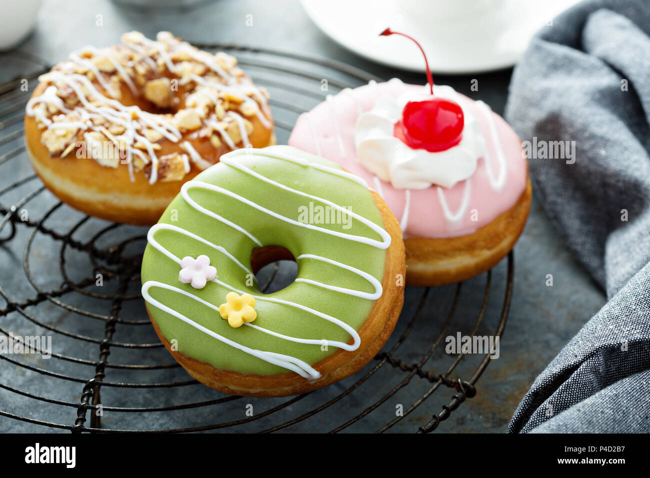 Sweet donuts on a cooling rack Stock Photo - Alamy