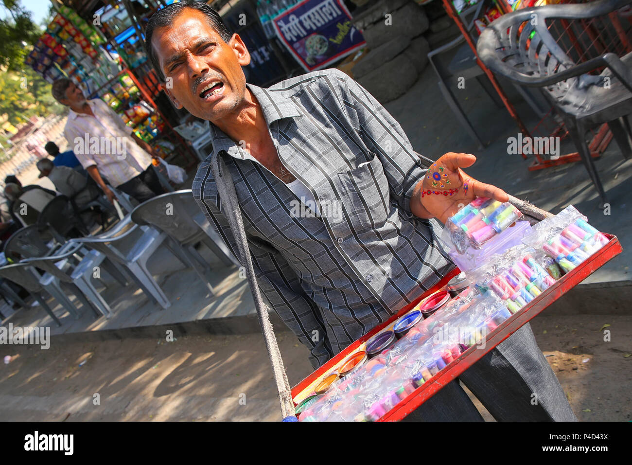 Local man selling colorful paint sets near City Palace in Jaipur ...
