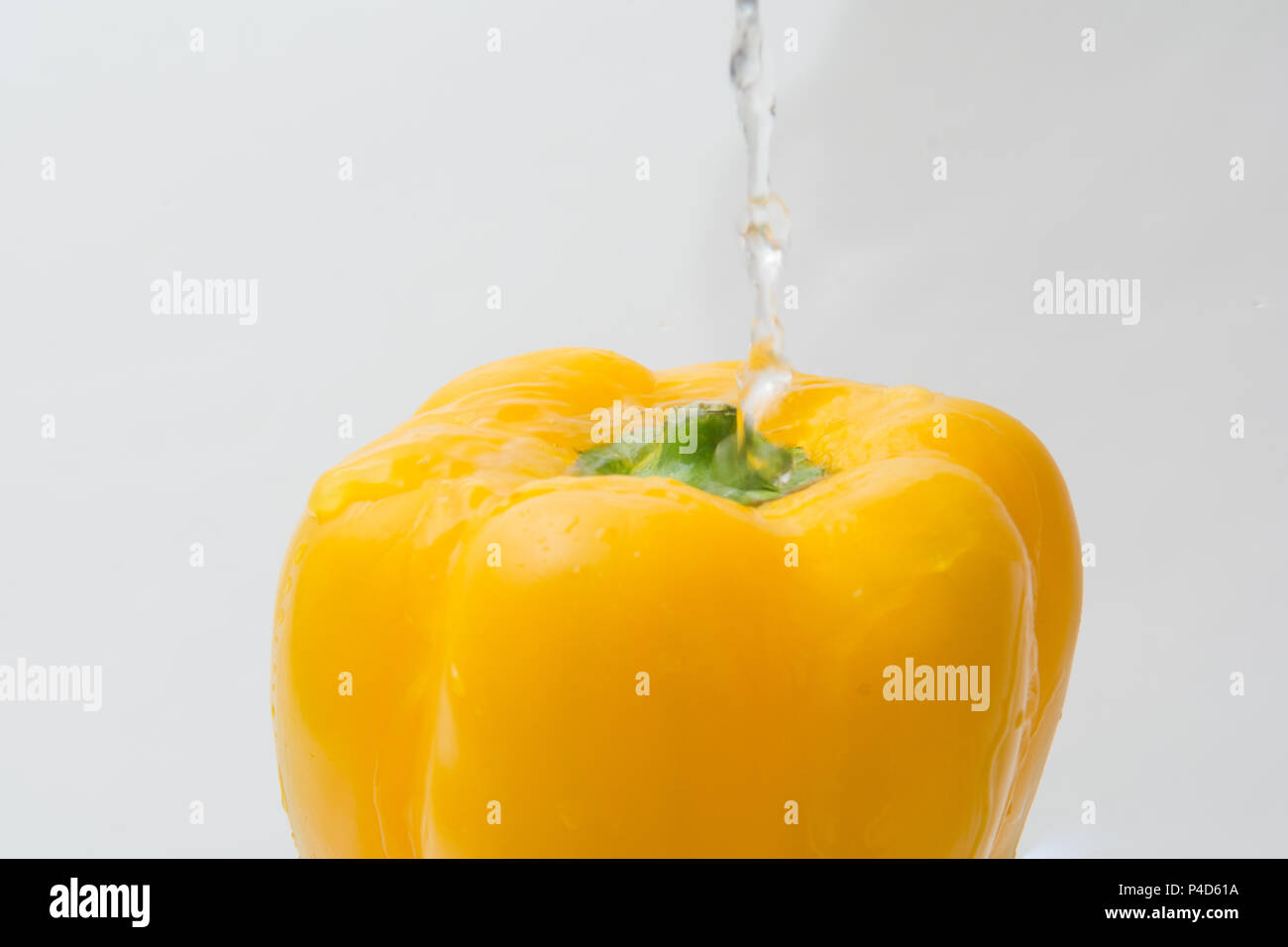 Whole fresh yellow pepper vegetable isolated on white Stock Photo - Alamy