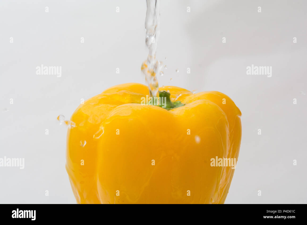 Whole fresh yellow pepper vegetable isolated on white Stock Photo - Alamy