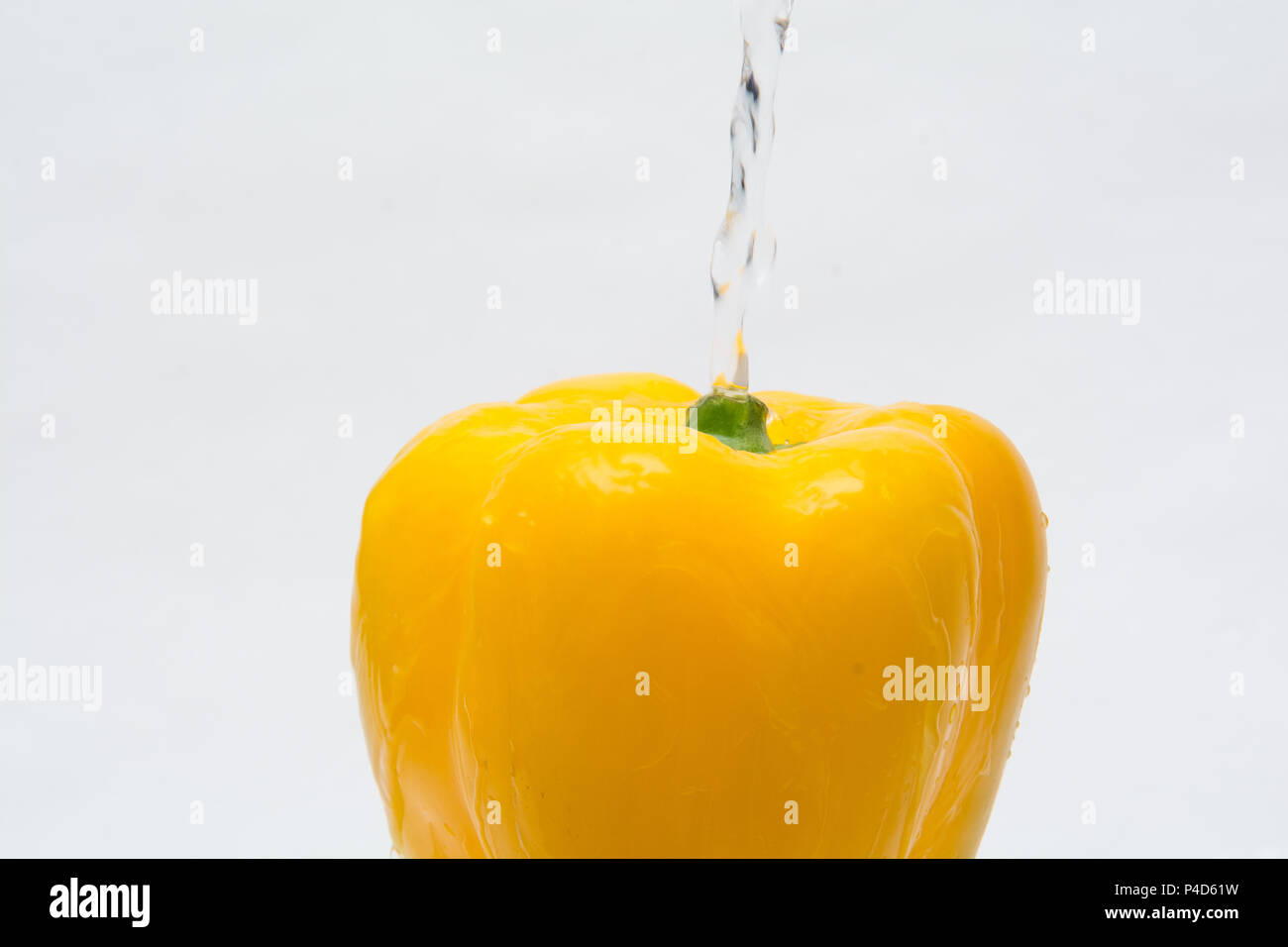 Whole fresh yellow pepper vegetable isolated on white Stock Photo - Alamy