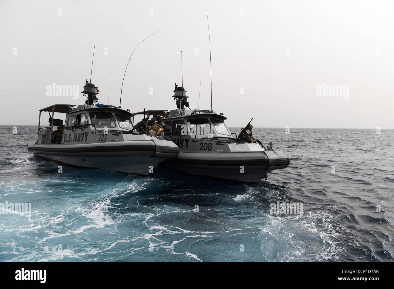 U.S. Navy members assigned to Coastal Riverine Squadron 10 prepare for ...