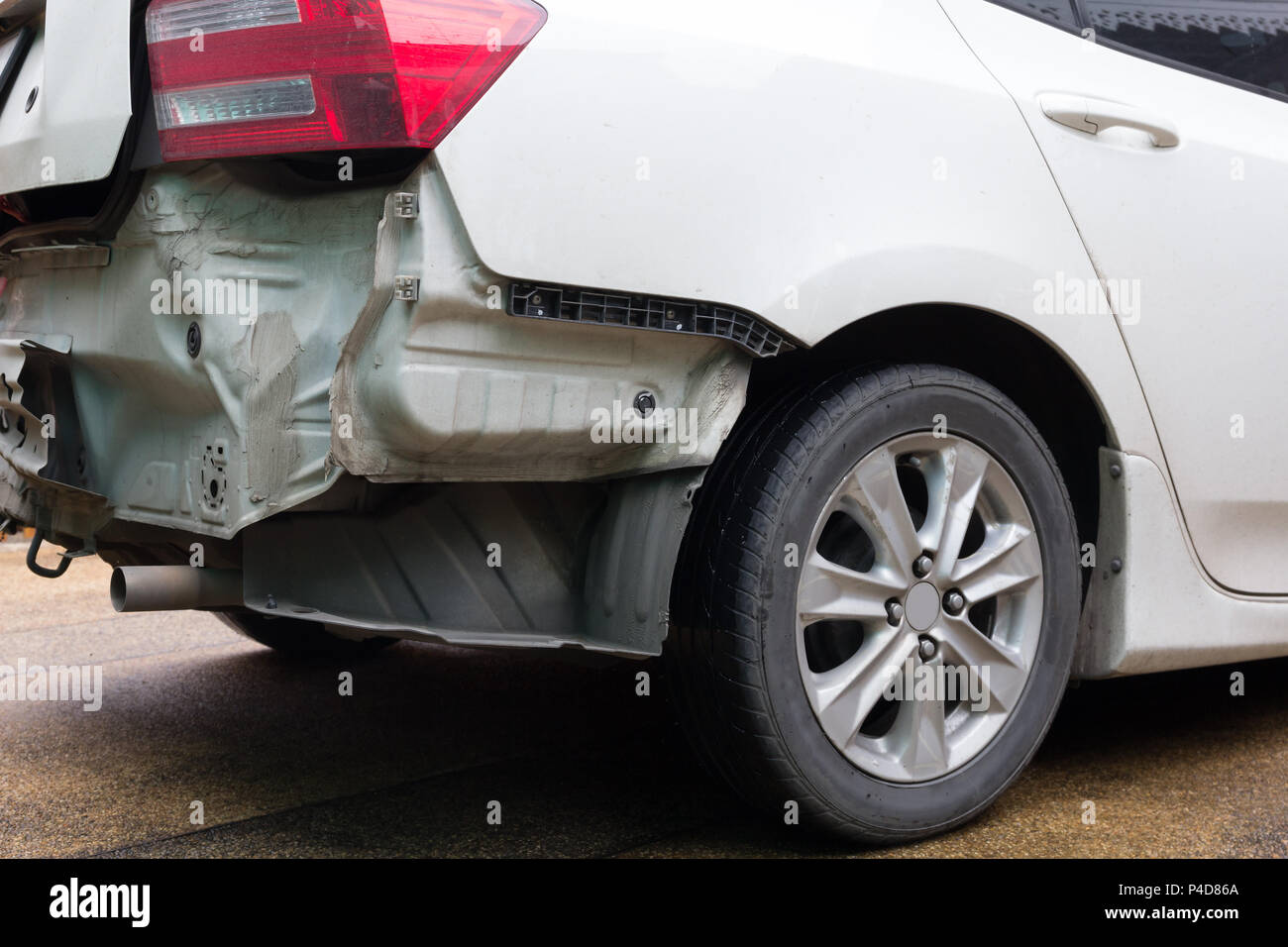 Close up back white city car after accident Stock Photo - Alamy