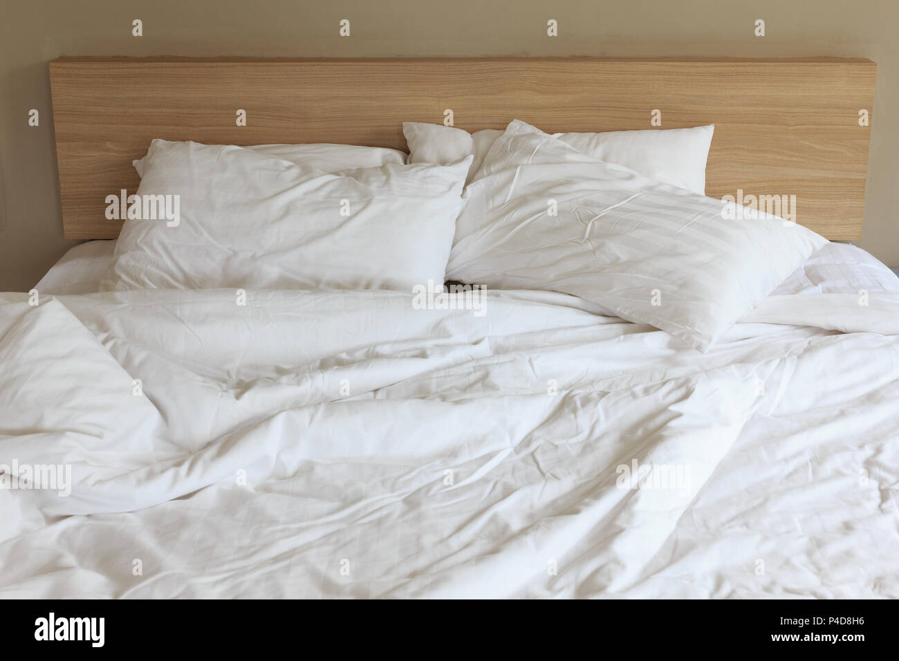 Messy white bed on the morning time. Modern bedding room interior Stock ...