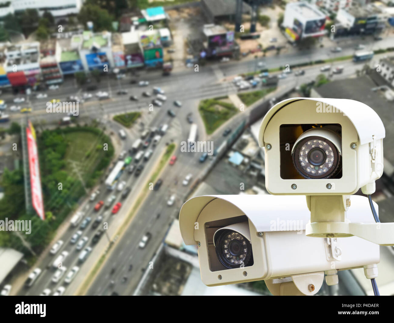 The CCTV Security Camera operating on traffic road blur background ...