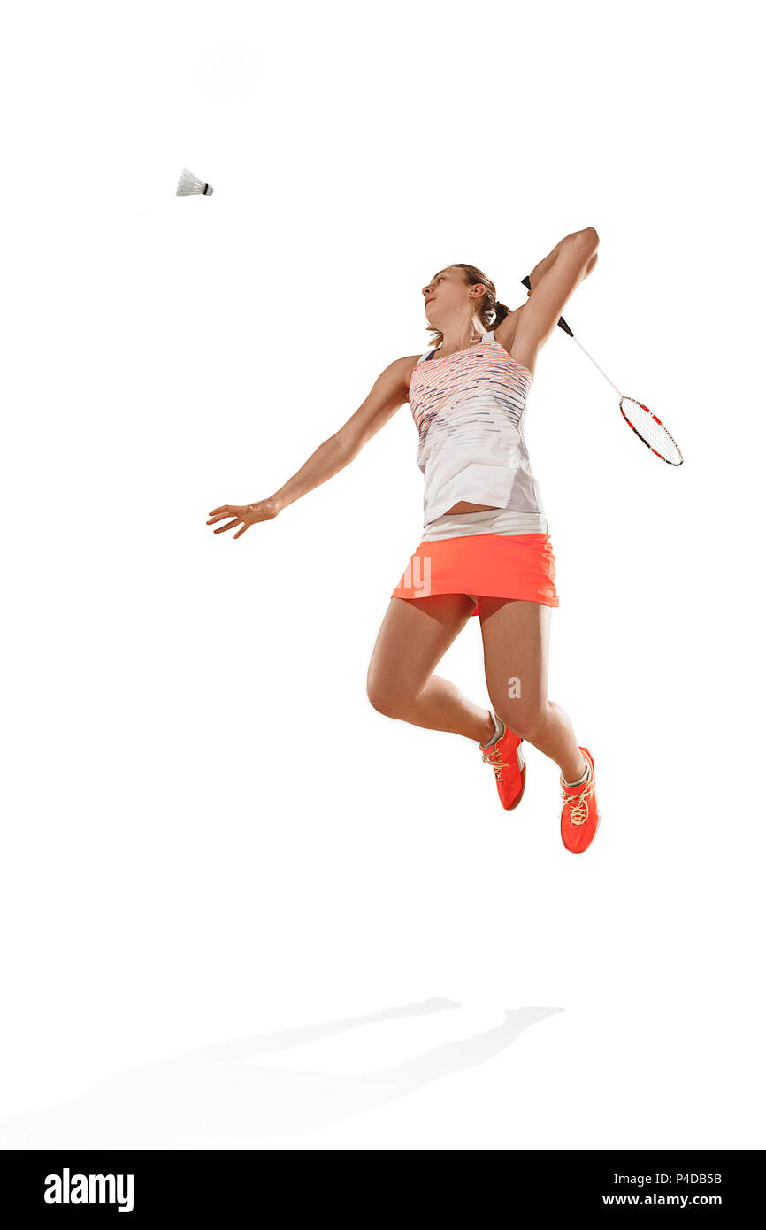 Young woman playing badminton over white background Stock Photo - Alamy