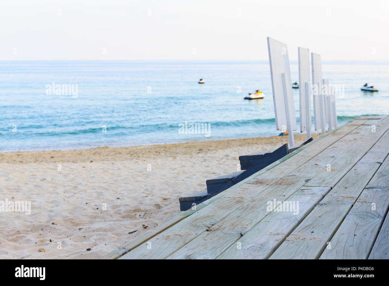 Wooden ladder bar on the beach, sea view background Stock Photo - Alamy