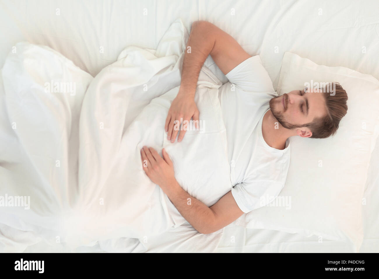 top view.the man lying on the couch at home Stock Photo - Alamy