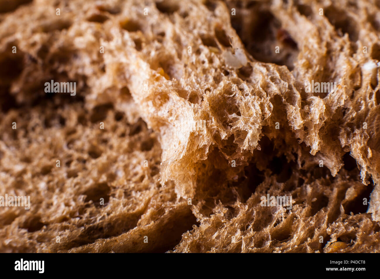 A slice of brown bread,up close Stock Photo - Alamy