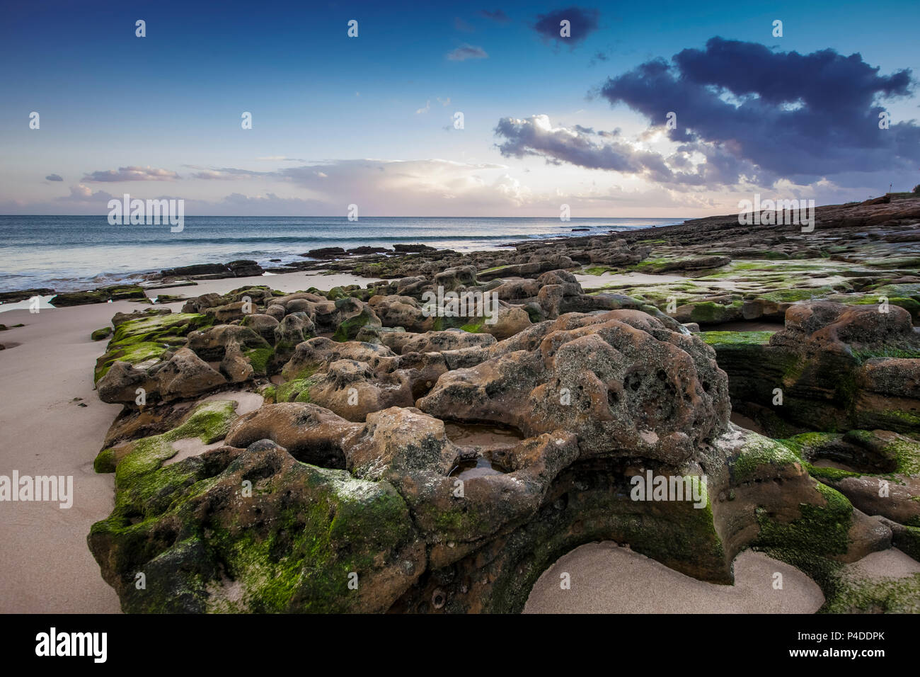 Rocky coast line beach sunset hi-res stock photography and images - Alamy