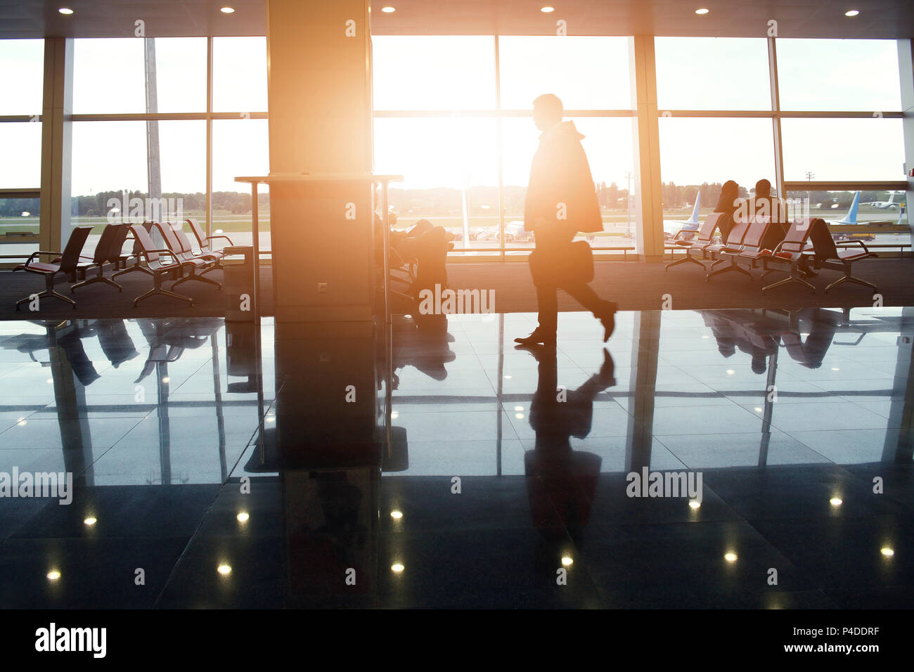 airport terminal and passangers in the waiting room Stock Photo - Alamy