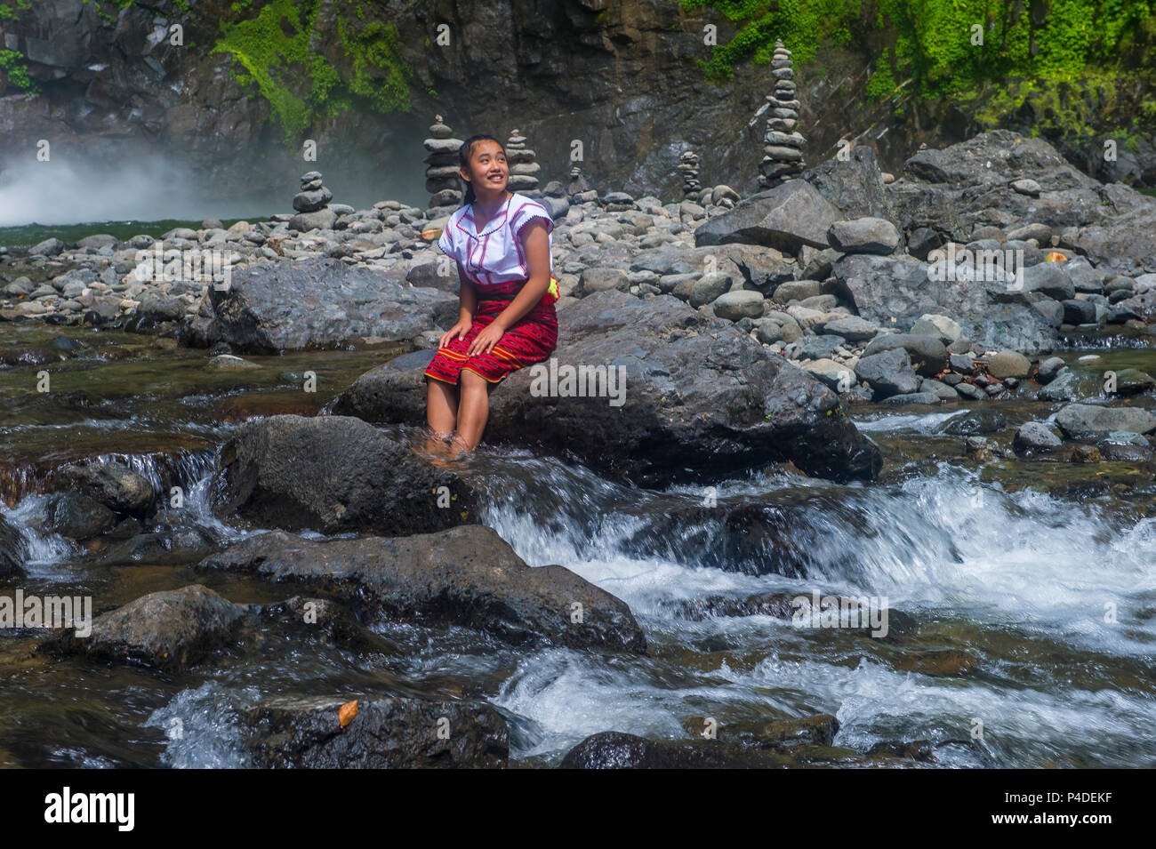 Girl from Ifugao Minority near a waterfall in Batad the Philippines ...