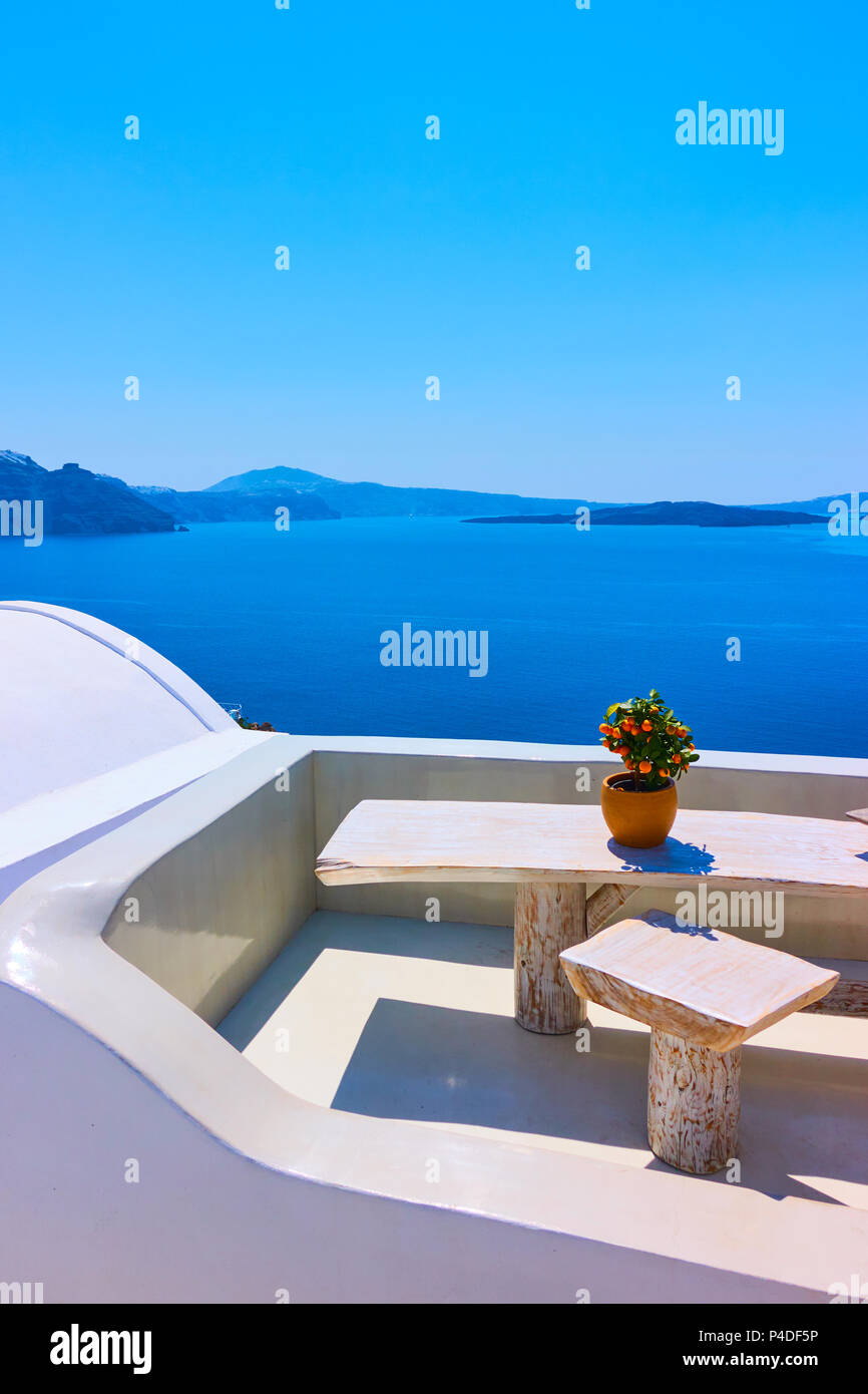 Terrace with table over sea, Santorini, Greece Stock Photo - Alamy