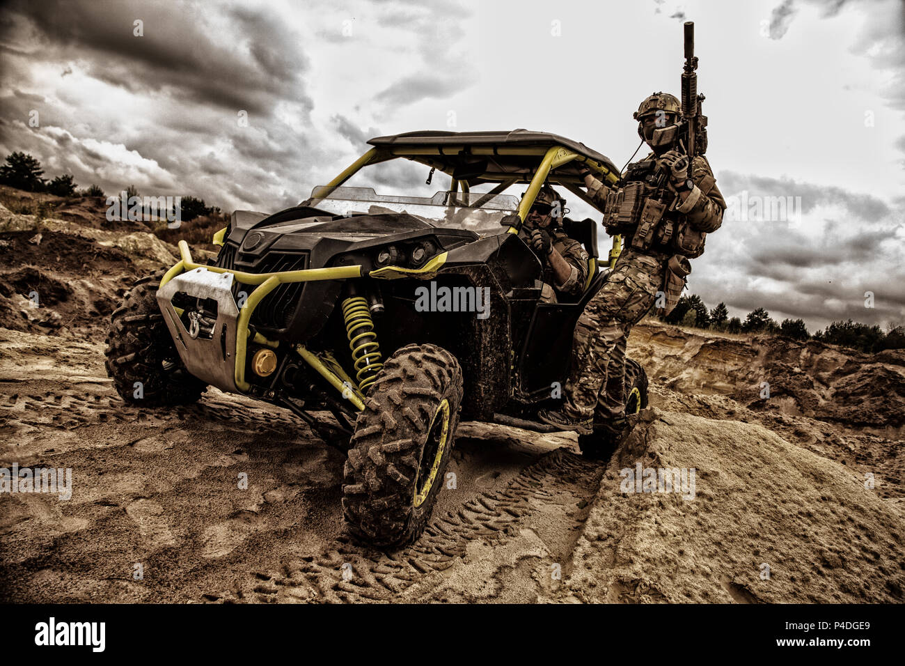 Commandos quick reaction combat group on buggy Stock Photo - Alamy
