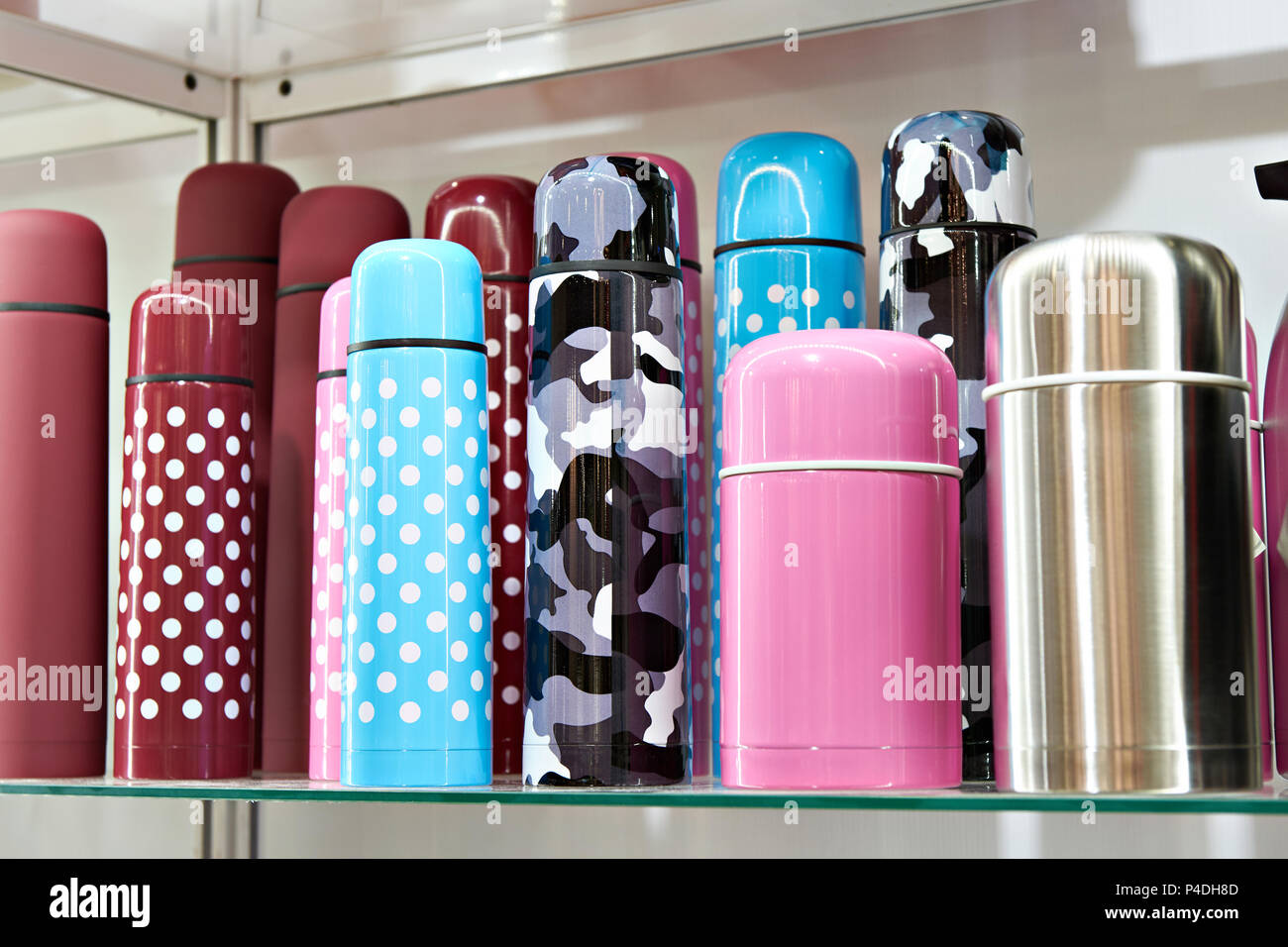 Colored thermos in the shop window Stock Photo - Alamy